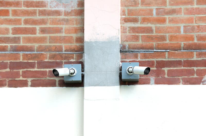 Two Surveillance Cameras on Red Brick Wall Stock Photo - Image of ...