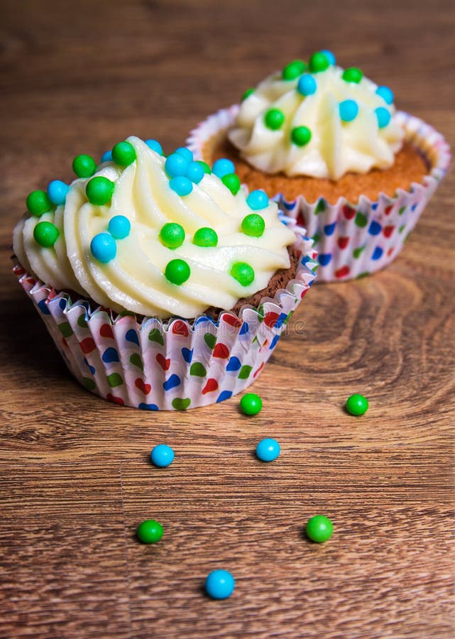 Two Sweet Cupcakes with Butter Cream Stock Photo - Image of paper ...