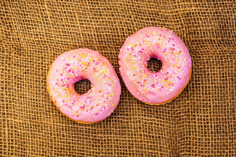 Two Sweet Donut with Pink Frosting Stock Photo - Image of diet, macro ...