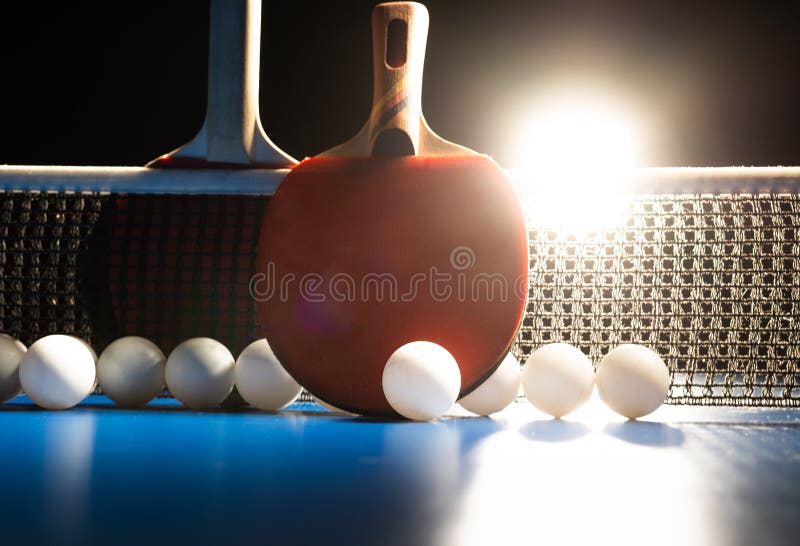 Ping Pong Rackets and Balls on a Blue Table with Net Stock Image ...