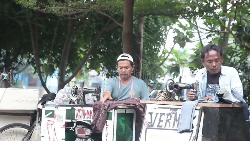 Two tailor men are sewing stock video. Video of supplies - 264411691