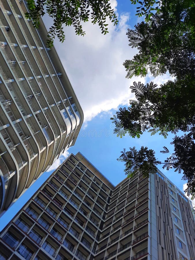 Two Tall Buildings Built Side by Side Stock Photo - Image of roof ...