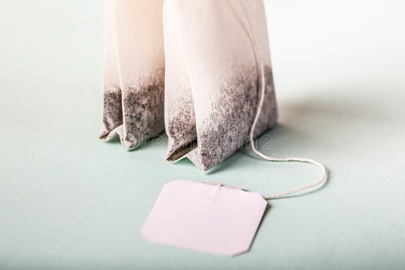 Two Tea Bags with White Label on Light Background Stock Photo - Image ...