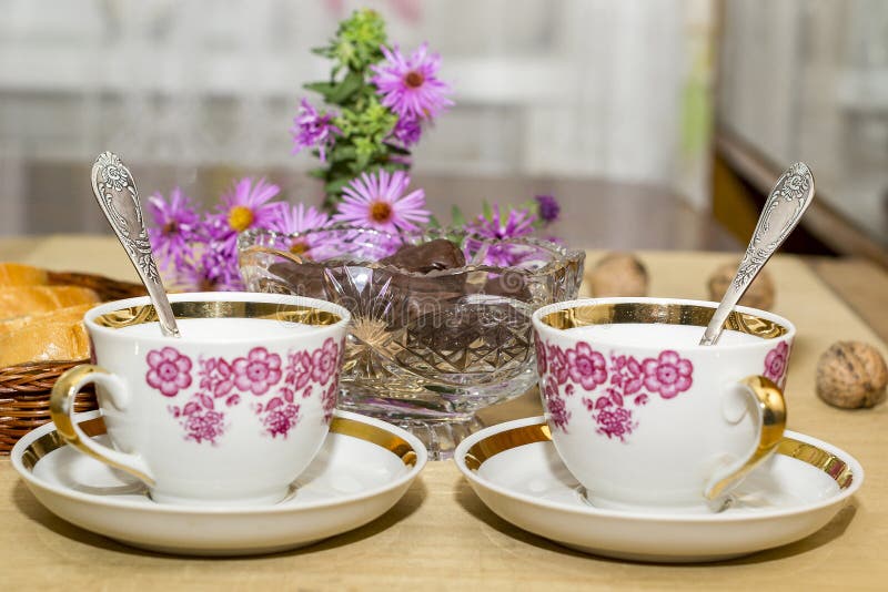 Two Tea Cups and Chocolate on a Wooden Table Stock Image - Image of ...