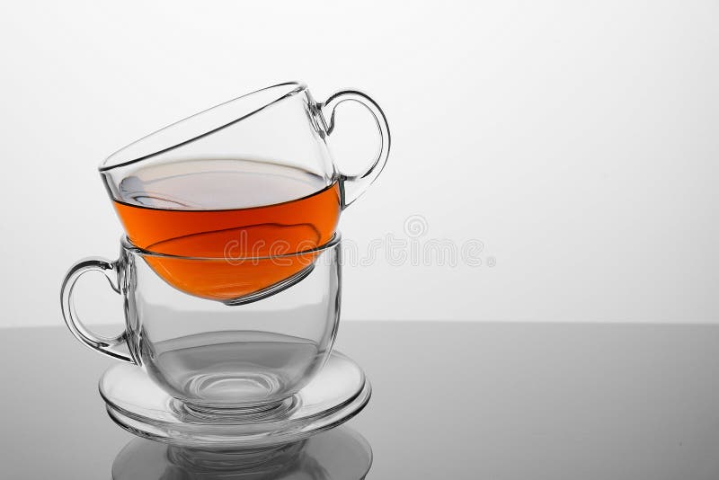 Two Tea Cups with Tea on a White Background. Stock Photo - Image of ...