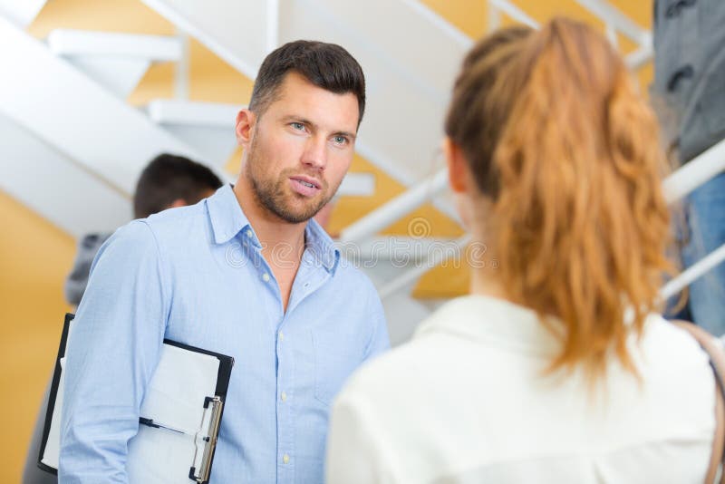 Two Teachers Talking in School Hall Stock Image - Image of school ...