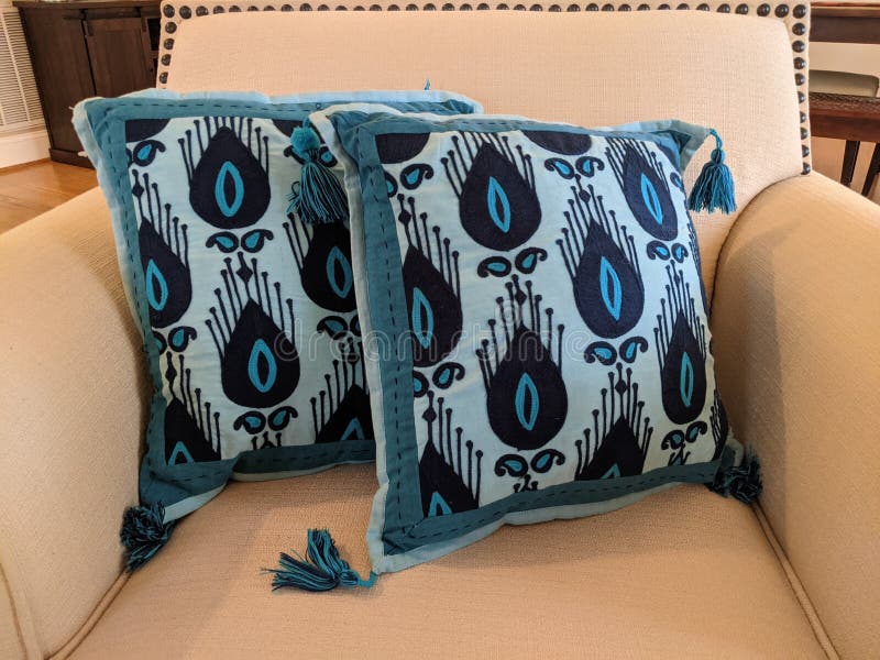 Two teal throw pillows stock photo. Image of furniture - 210434196