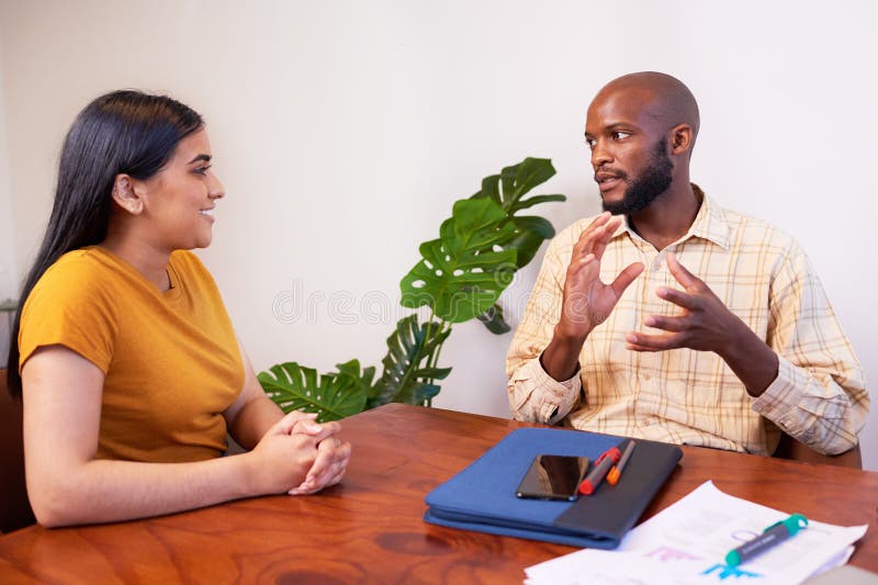 Two Team Members in a Discussion at Boardroom Table, Hand Gestures ...