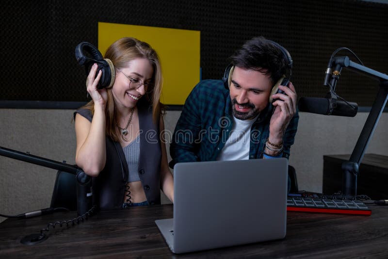 Two Team Members Having a Sound Check and Looking Involved Stock Image ...