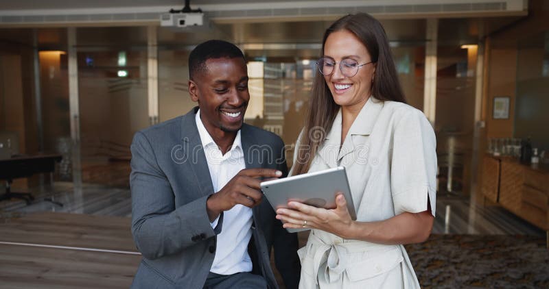 Two Teammates Working on Joint Task Using Tablet Stock Video - Video of ...