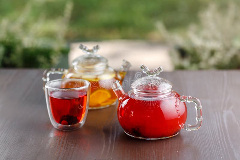 Two teapots of fruit tea stock photo. Image of green - 75548888