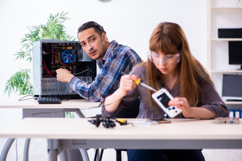 Two Technicians Working at Computer Warranty Center Stock Image - Image ...