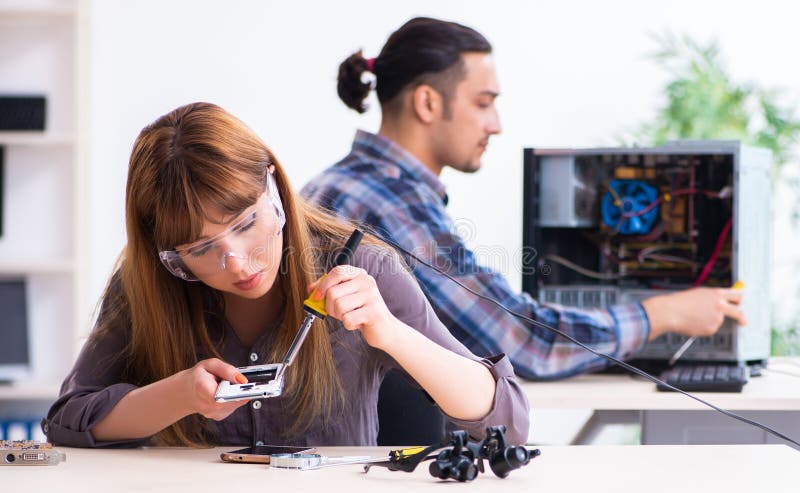 Two Technicians Working at Computer Warranty Center Stock Photo - Image ...