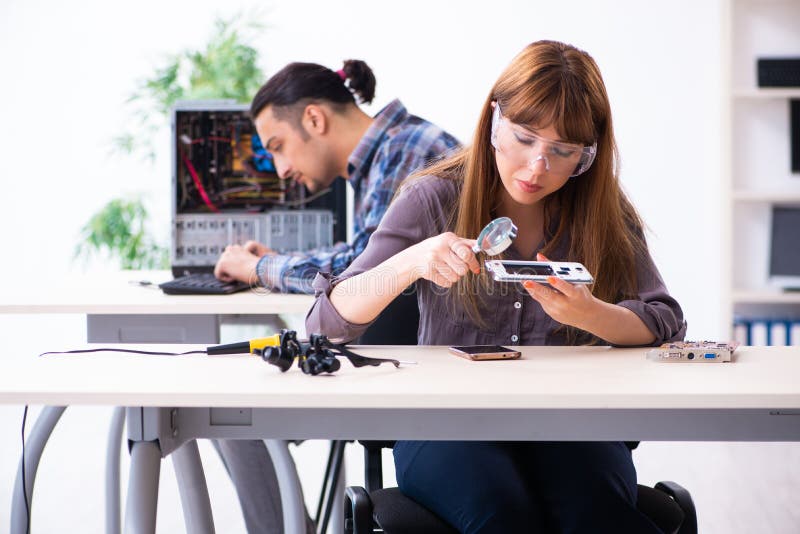 Two Technicians Working at Computer Warranty Center Stock Photo - Image ...