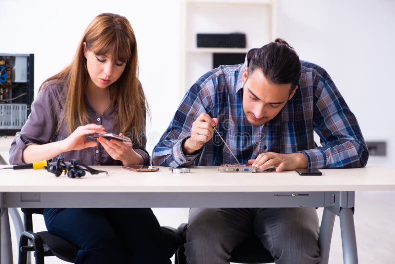 Two Technicians Working at Computer Warranty Center Stock Image - Image ...