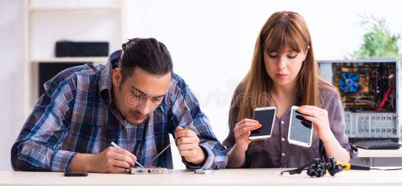Two Technicians Working at Computer Warranty Center Stock Image - Image ...