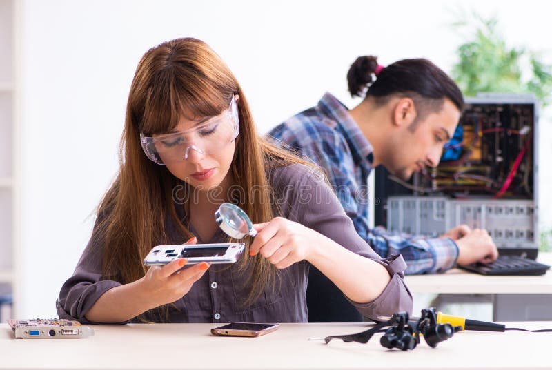 Two Technicians Working at Computer Warranty Center Stock Image - Image ...