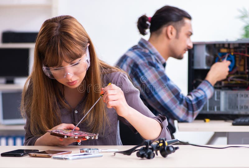 Two Technicians Working at Computer Warranty Center Stock Image - Image ...