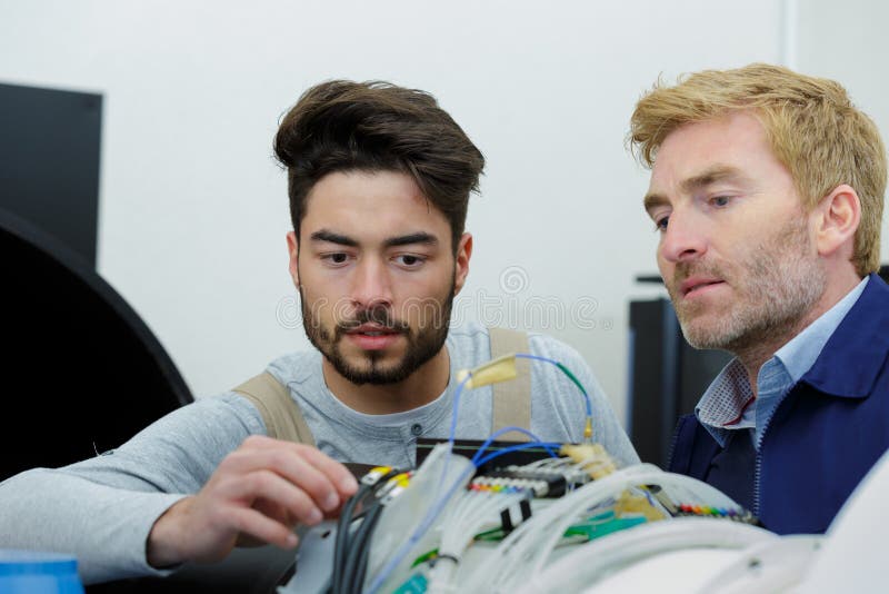 Two Technicians Working on Machine Stock Photo - Image of workers ...