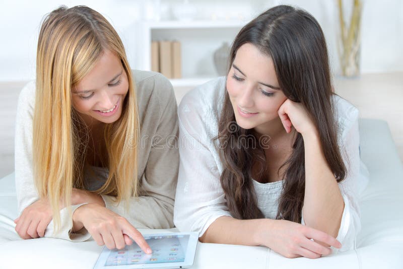 Two Teen Young Friends Using Computer Tablet Stock Image - Image of ...