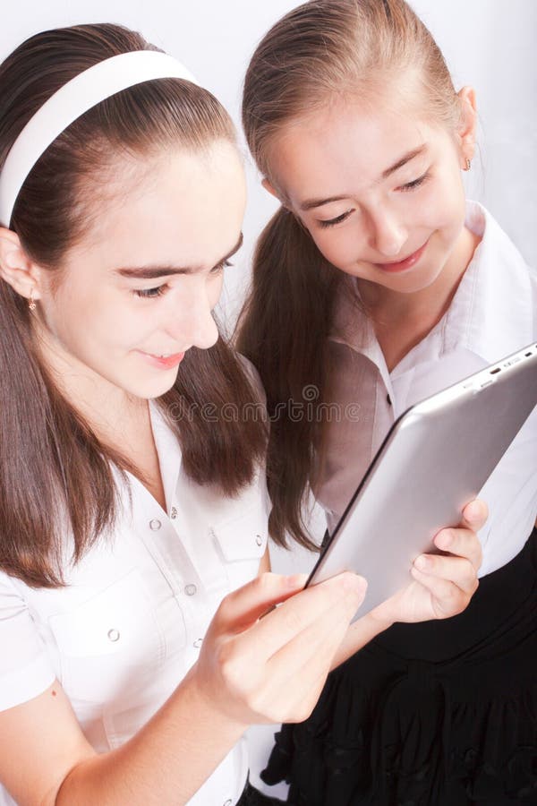 Two Girl with Ipad Like Gadget Stock Image - Image of ipad, news: 30001055