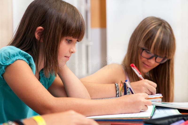 Two Teenagers Doing Homework. Stock Photo - Image of children, friends ...