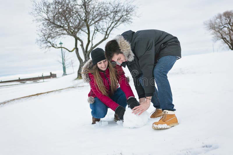 Two Teenagers Havinf Fun on the Snow Field Stock Photo - Image of frost ...
