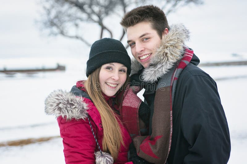 Two Teenagers Havinf Fun on the Snow Field Stock Image - Image of ...