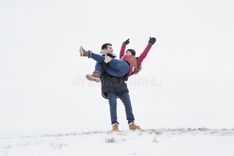 Two Teenagers Havinf Fun on the Snow Field Stock Image - Image of happy ...