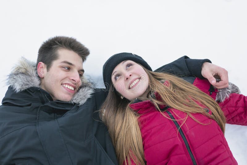 Two Teenagers Havinf Fun on the Snow Field Stock Image - Image of frost ...