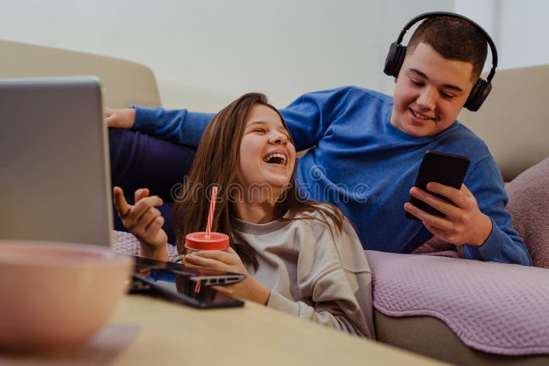 Two Teenagers Having Fun at Home Stock Photo - Image of earphones ...