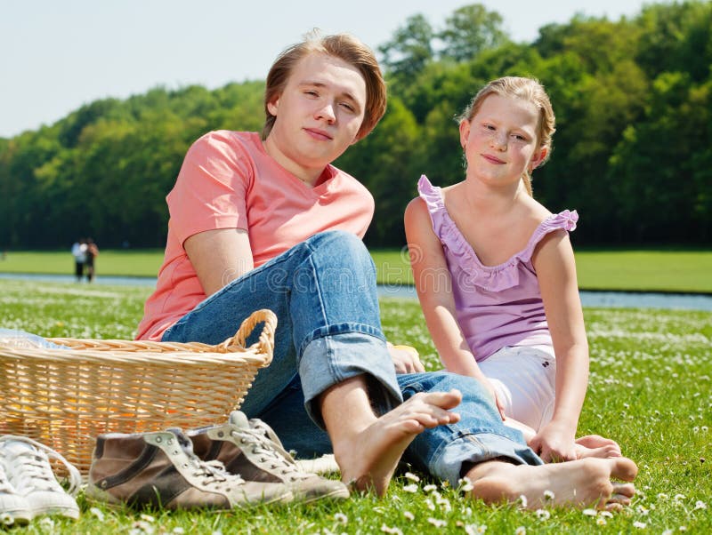 Two teenagers at picnic stock photo. Image of unshod - 19479514