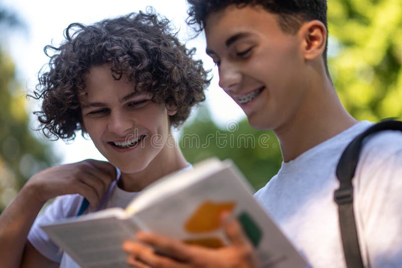 Two Teens Reading Books Together and Looking Enjoyed Stock Photo - Image of carefree, friends ...