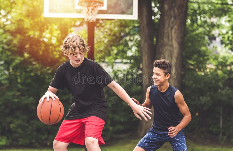 Two Teens in Sportswear Playing Basketball Game Stock Photo - Image of ...