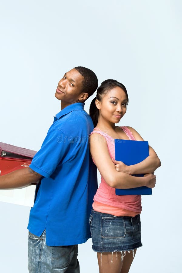 Two Teens Stand Back To Back - Vertical Stock Photo - Image of mischief ...