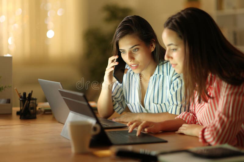 Two Tele Workers Talking on Phone Solving Online Problem Stock Image ...