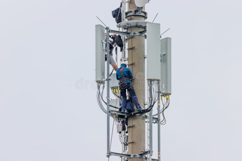 Telekom Technicians Perform Work on a Transmission Tower Stock Photo ...