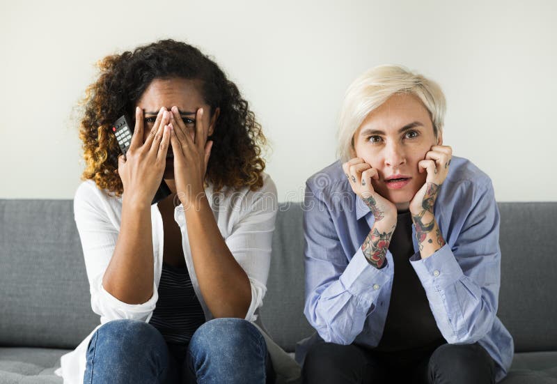 Two Terrified Girls on a Couch Stock Image - Image of fearful, looking ...