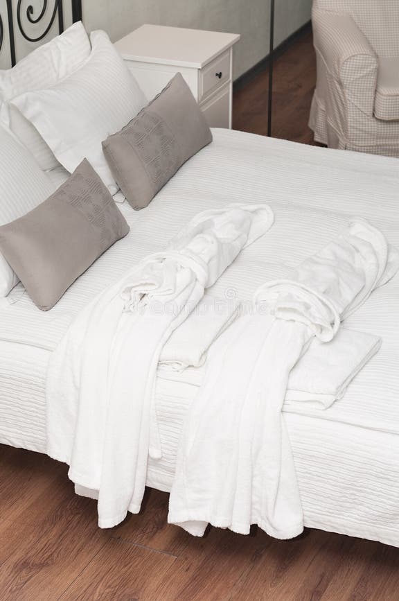 Two Terry White Bathrobe on Bed Stock Image - Image of mattress ...