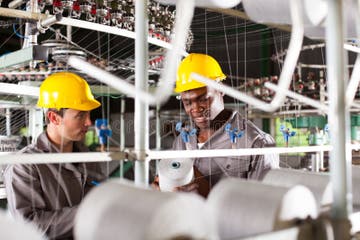 Two textile workers stock photo. Image of cloth, plant - 27311106