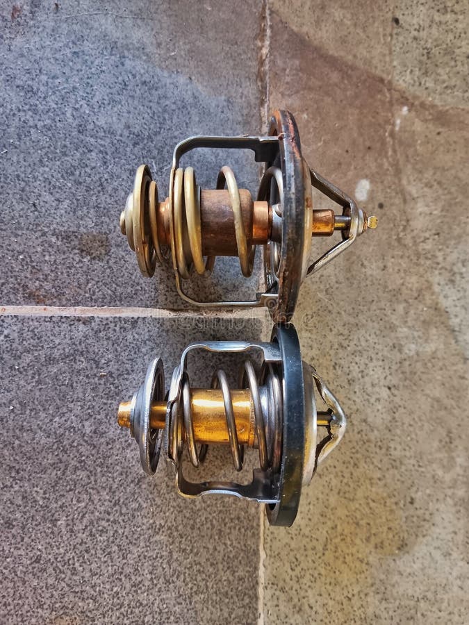 Two Thermostats of Different Sizes and Lifespans are Placed Side by Side for Comparison. Stock ...
