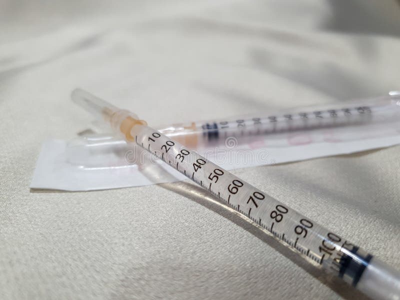 Syringes with Medical Liquid in the Doctor Hands Dressed in the Medical ...