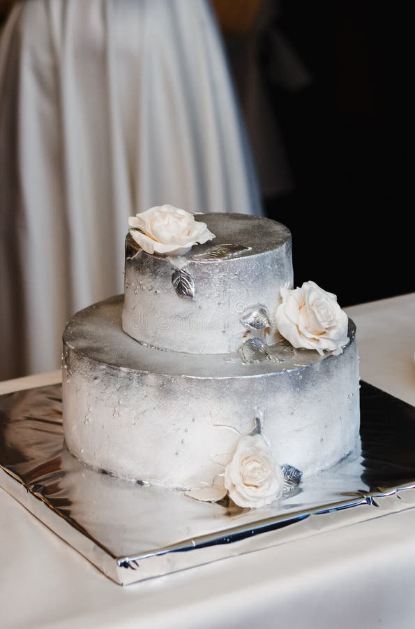 Two-tier Cake Decorated with Silver Glaze and White Roses Stock Photo ...