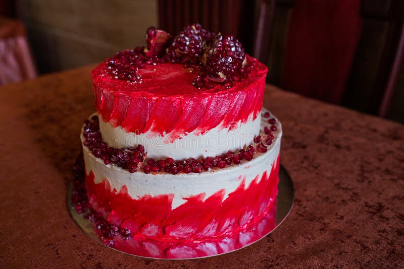 Two Tier White and Red Cake with Pomegranate Stock Photo - Image of ...
