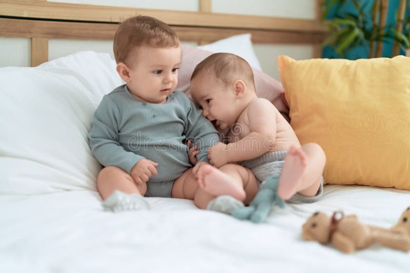 Two Toddlers Sitting on Bed at Bedroom Stock Image - Image of blond ...