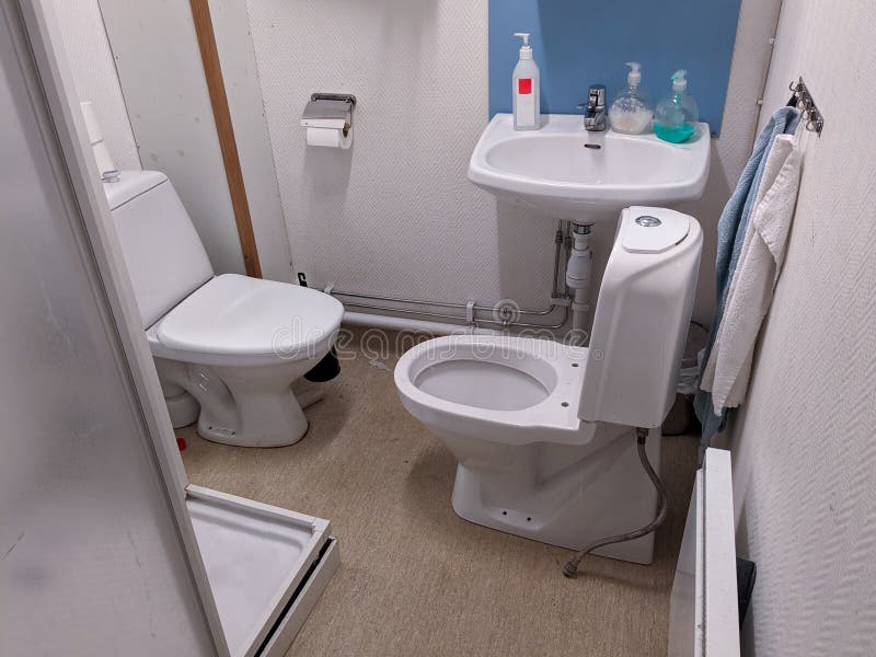 Two Toilets Inside a Restroom Stock Photo - Image of toilet, apartment ...
