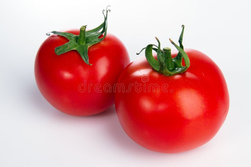 Two tomatoes stock image. Image of background, leaf, healthy - 20258159