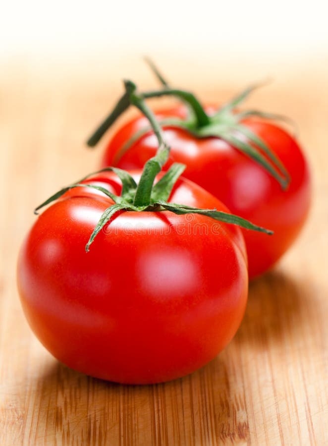 Two tomatoes on the board. stock photo. Image of natural - 29095346