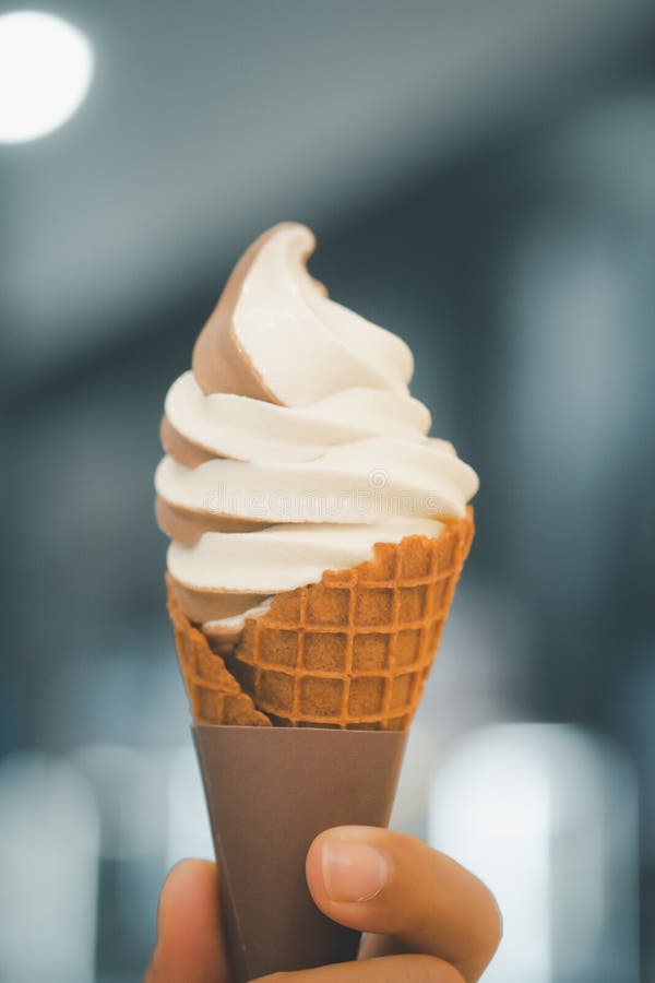 Two-tone Soft Serve Ice Cream Cone in Hand Stock Image - Image of ...