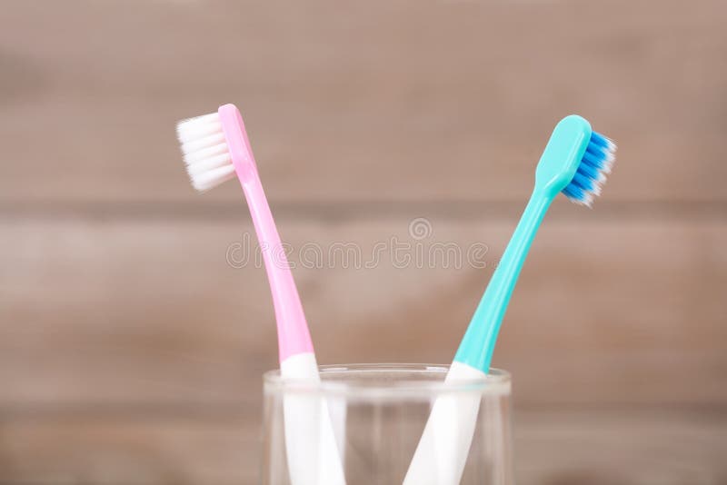 Two Toothbrushes in a Glass Stock Photo - Image of hygiene ...